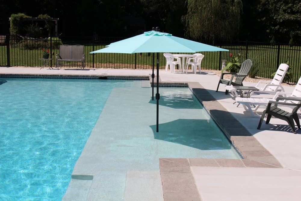 Swimming Pool with Sun Shelf | The Pool Company Construction