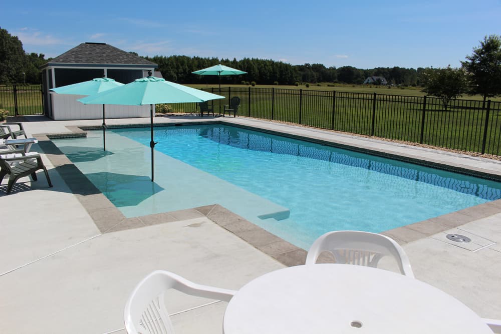 Swimming Pool with Sun Shelf | The Pool Company Construction